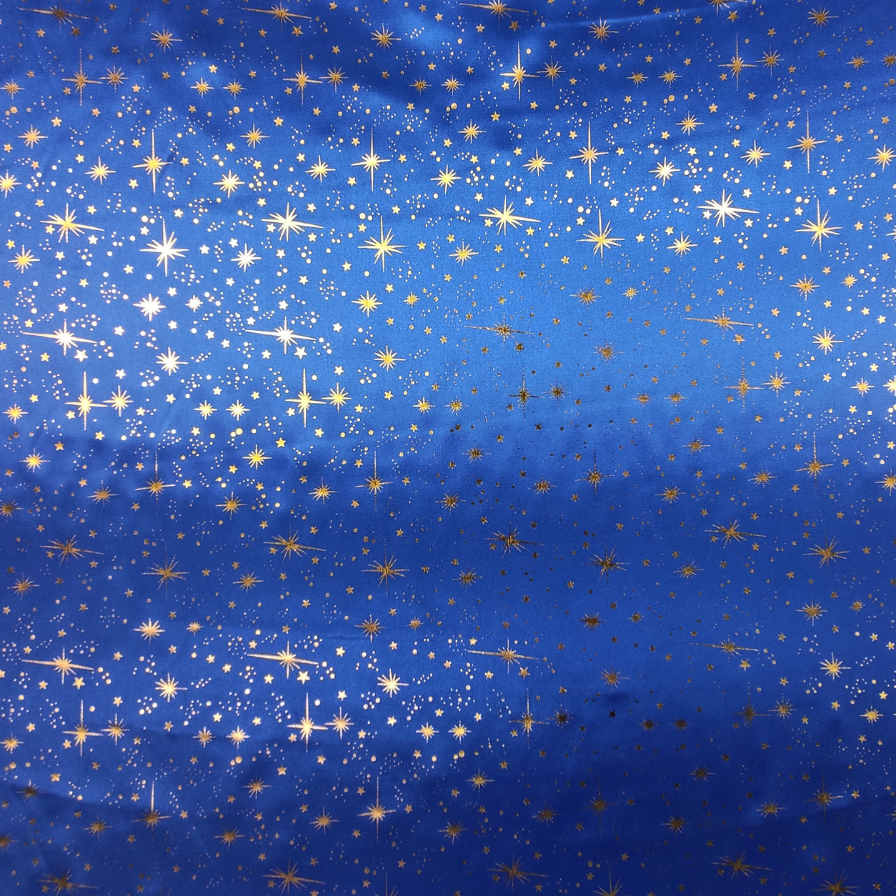 Tessuto in Raso Stampato Stelle Oro Sfondo