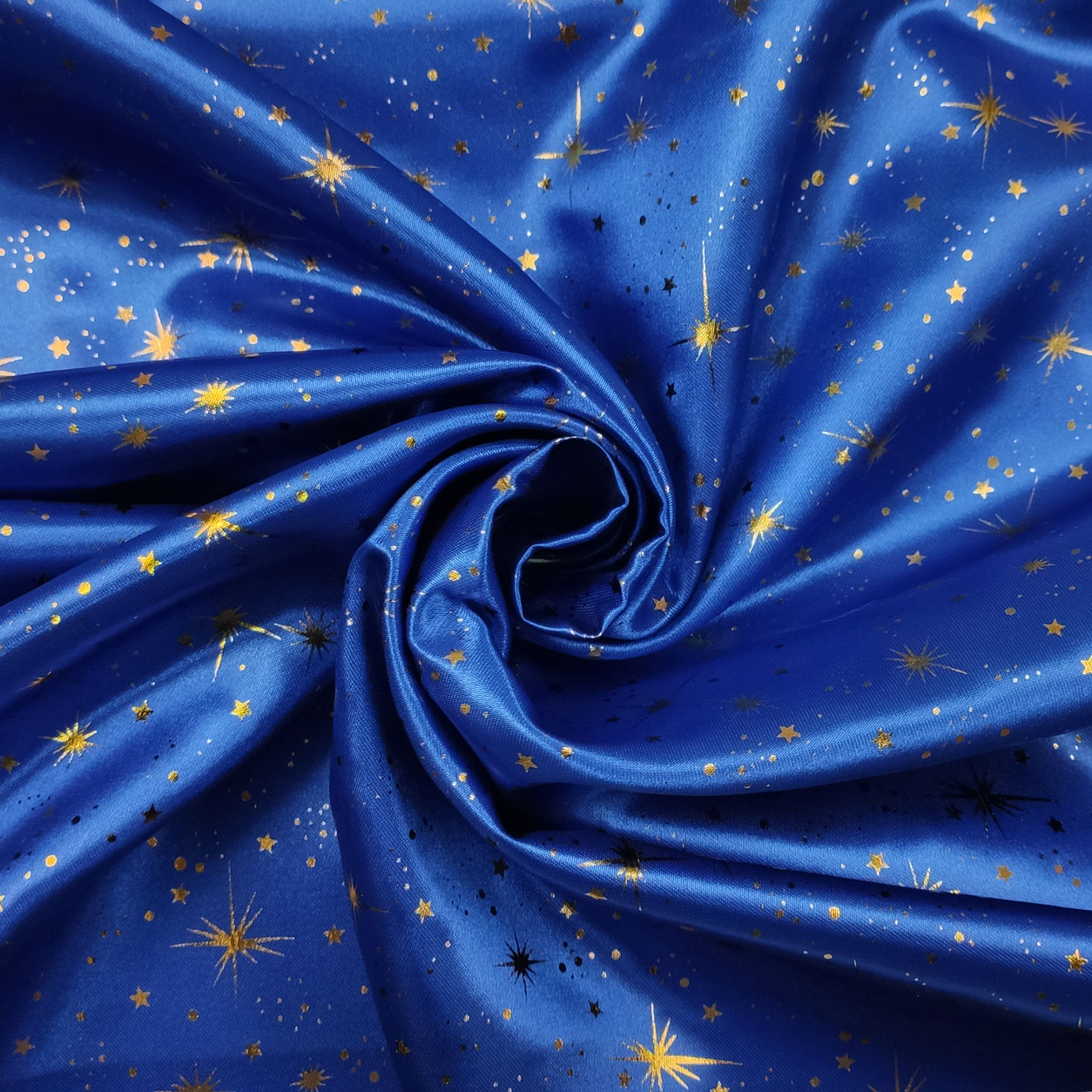 Tessuto in Raso Stampato Stelle Oro Sfondo